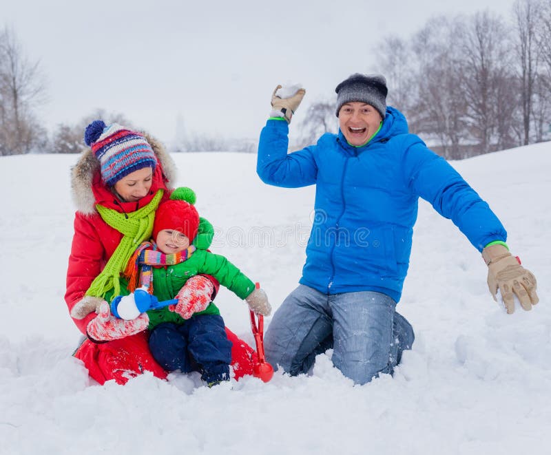 Family having fun in snow stock image. Image of lifestyle - 63757279