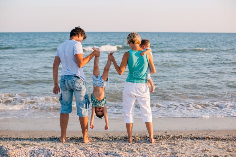 Family Having Fun on Tropical Beach Stock Photo - Image of adult, sand ...