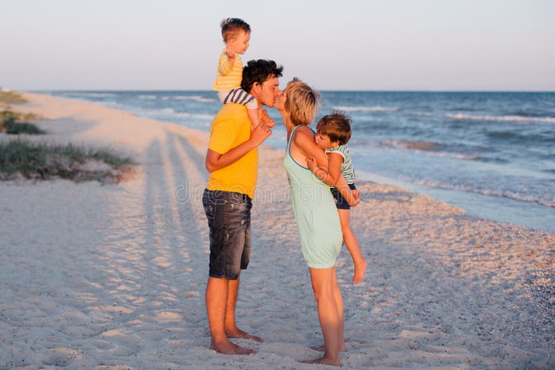 Family Having Fun on Tropical Beach Stock Photo - Image of happy, coast ...