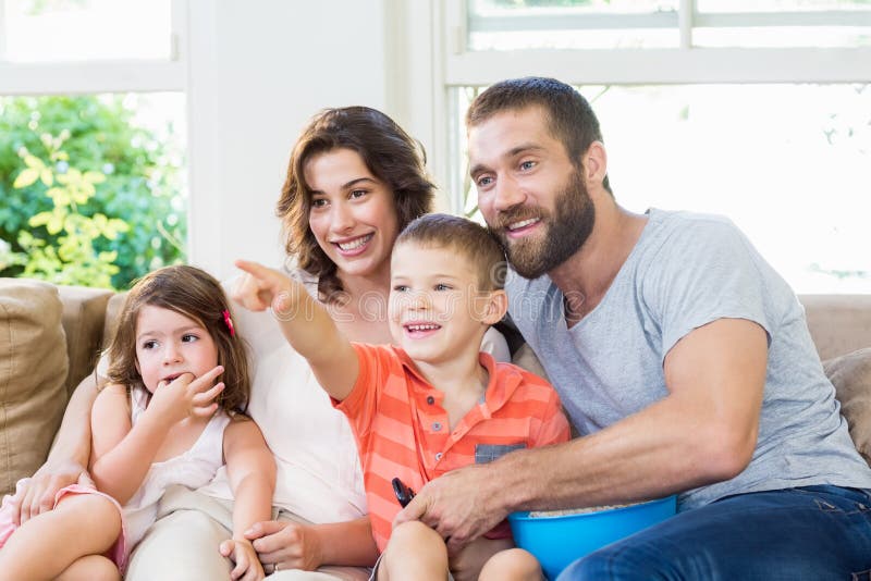 Family Having Fun while Watching Television Stock Photo - Image of home ...