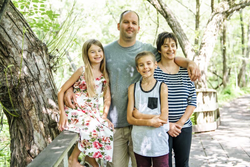 Family Having Good Time in Forest with Child Stock Image - Image of ...
