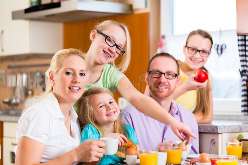 Family Having Joint Breakfast in Kitchen Stock Photo - Image of food ...
