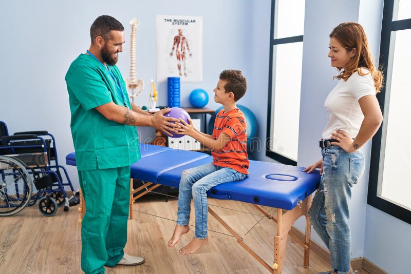 Family Having Rehab Session Using Ball at Rehab Clinic Stock Image ...