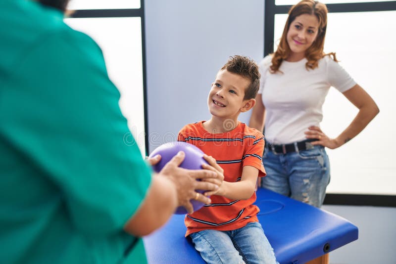 Family Having Rehab Session Using Ball at Rehab Clinic Stock Image ...