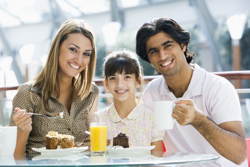Family Having Snack at Cafe Stock Photo - Image of child, daughter: 5210140