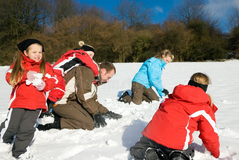 Family Having a Snowball Fight Stock Image - Image of daughters ...