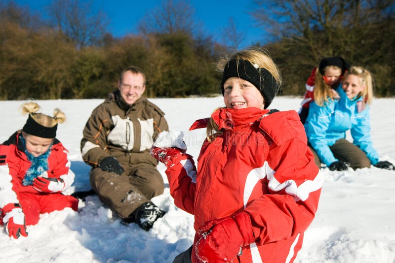 Family Having a Snowball Fight Stock Image - Image of cold, playful ...