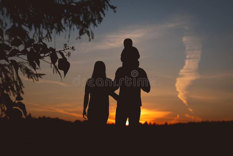 Family Having a Walk at Sunset Stock Image - Image of snug, shoulders ...