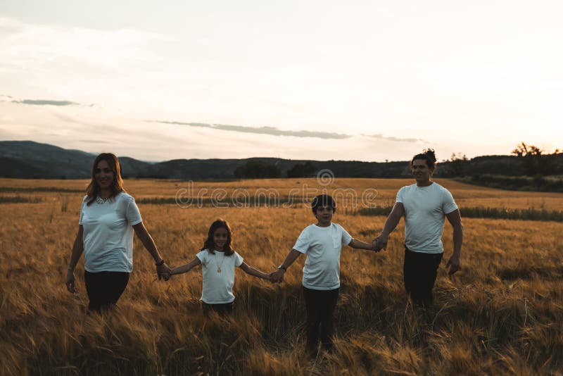 Family Holding Hands in the Countryside Happy Stock Image - Image of ...