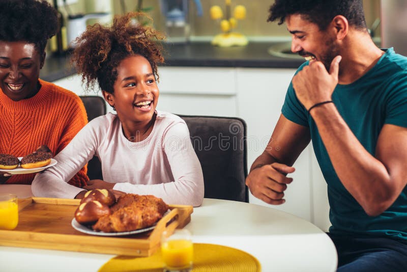 Family at Home Eating Breakfast in Kitchen Together Stock Image - Image ...