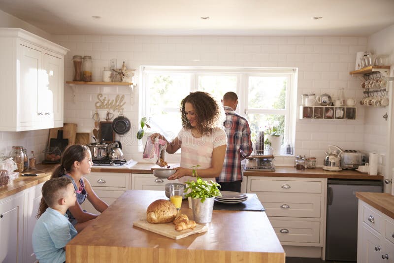 Family at Home Eating Breakfast in Kitchen Together Stock Photo - Image ...