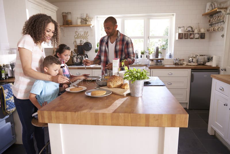 Family at Home Eating Breakfast in Kitchen Together Stock Image - Image ...