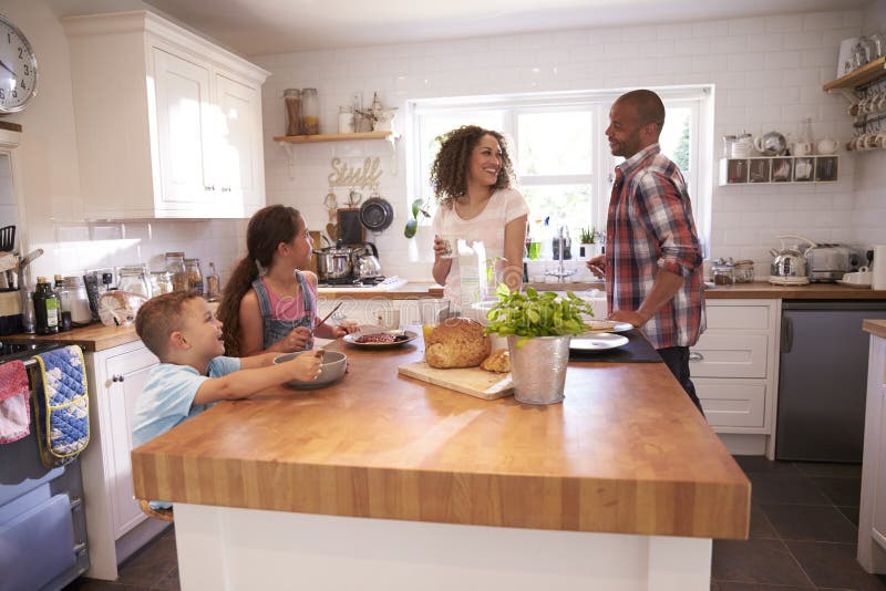 Family at Home Eating Breakfast in Kitchen Together Stock Image - Image ...
