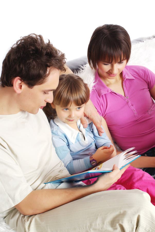 Family at Home Reading Book Stock Image - Image of book, reading: 9218689