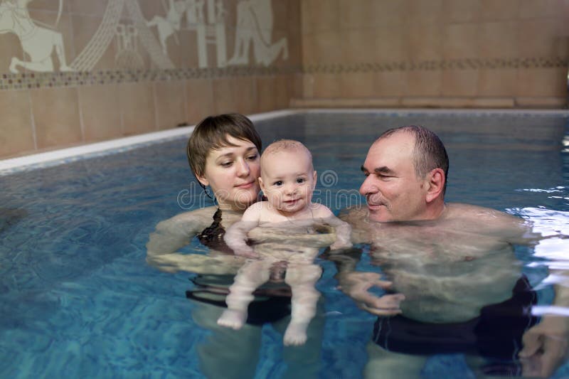 Family in indoor pool stock photo. Image of manl, female - 25238924