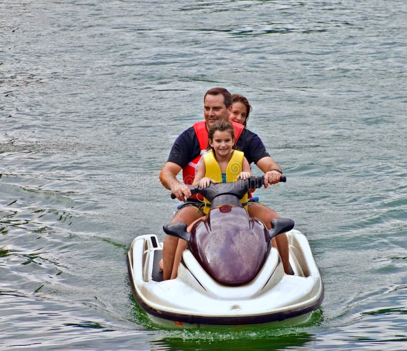 Family on a Jet Ski stock image. Image of father, children - 19912453