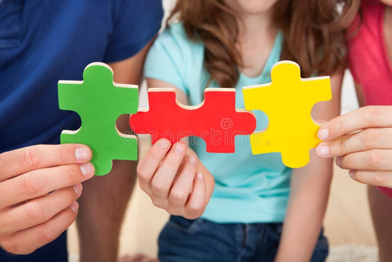 Joining two puzzle pieces stock image. Image of successful - 13405903