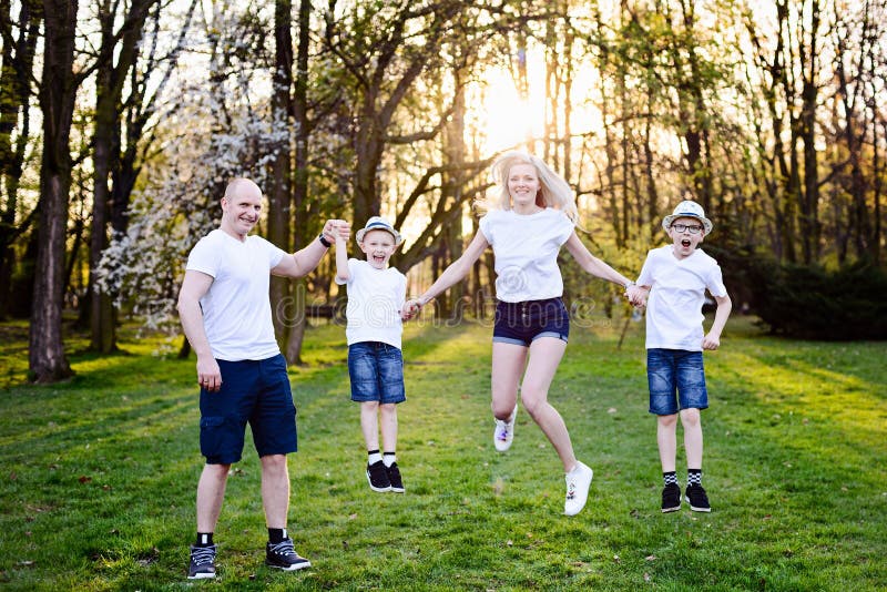 Family jump in park. stock image. Image of leisure, outside - 116162387