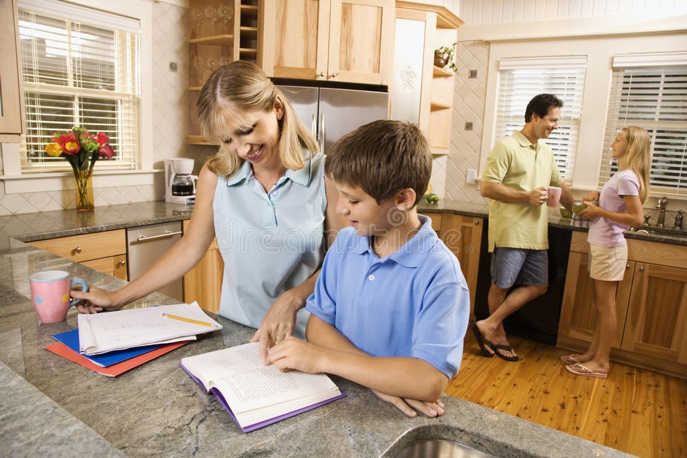 Family in Kitchen Doing Homework. Stock Photo - Image of guidance ...
