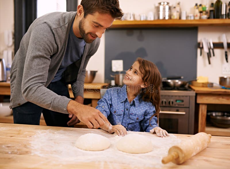 Family Kitchen Fun. a Father and Daughter Working with Pizza Dough in ...