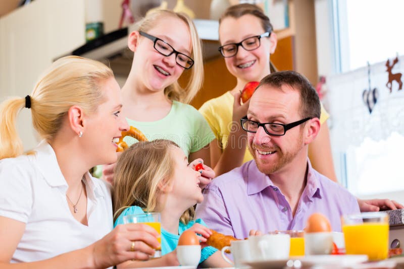 Family in Kitchen Having Breakfast Together Stock Photo - Image of ...