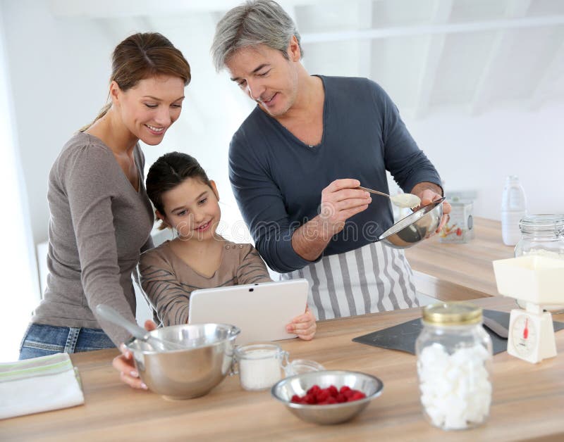 Family in Kitchen Preparing Pastries Stock Image - Image of internet ...