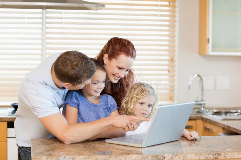 Family with Laptop in the Kitchen Stock Image - Image of internet ...