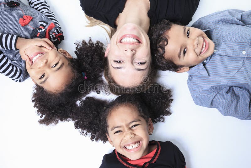 A Family Lay on the Floor of a Photography Studio Stock Image - Image ...