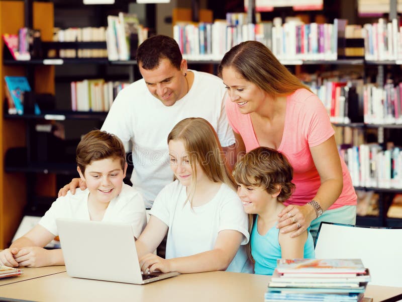 Family in library stock image. Image of literature, happy - 53162609