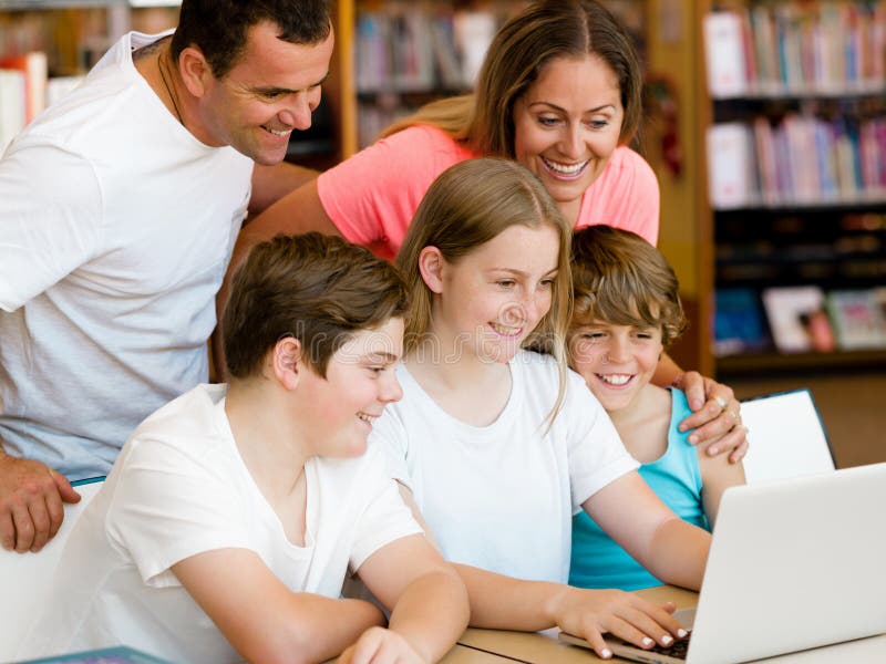 Family in library stock photo. Image of portrait, happy - 60542454