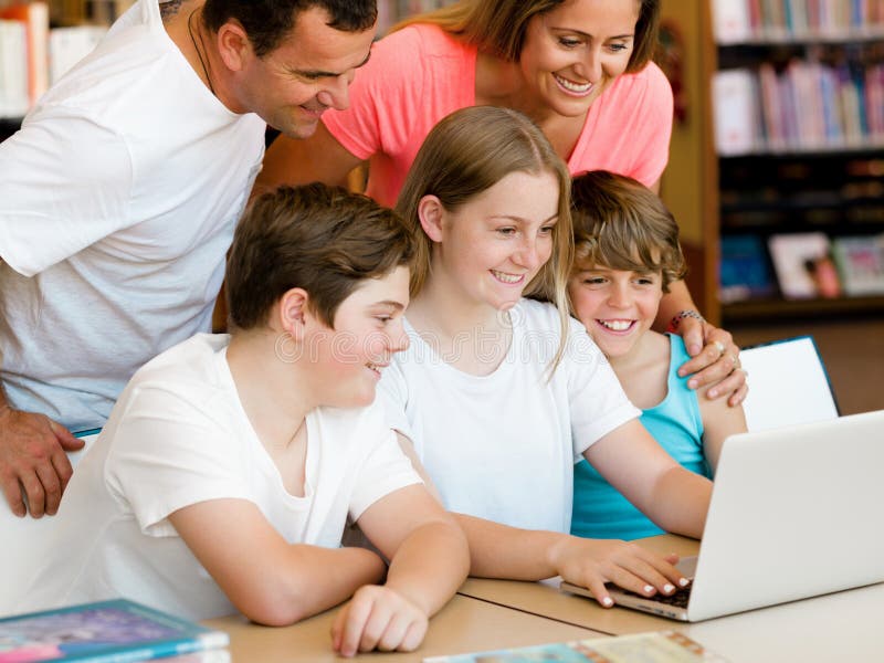 Family in library stock photo. Image of learn, brother - 100988130