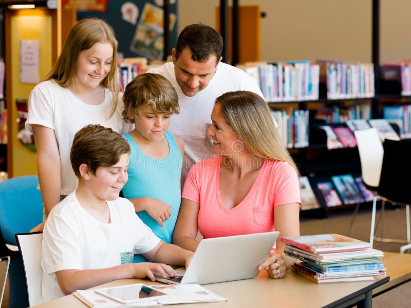 Family in library stock image. Image of people, computer - 101312225