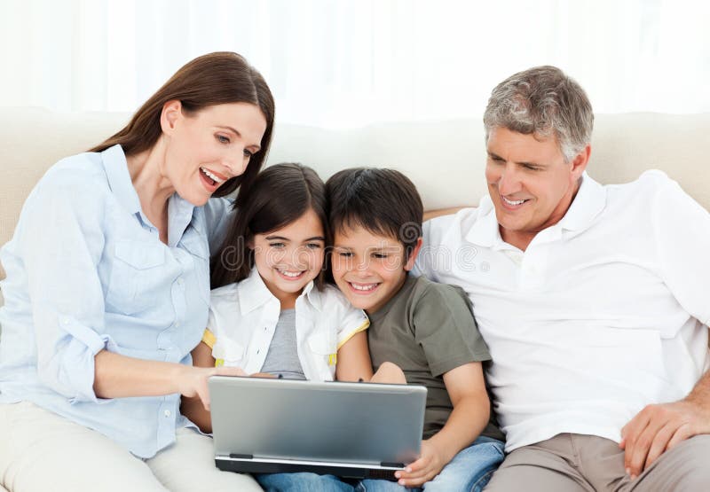 Family Looking at Laptop Over Breakfast Stock Photo - Image of ...