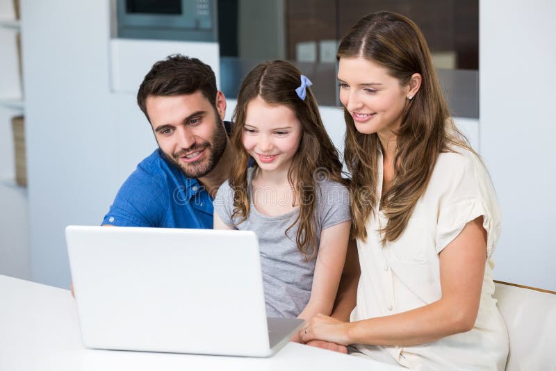 Family looking at laptop stock photo. Image of daughter - 68206370