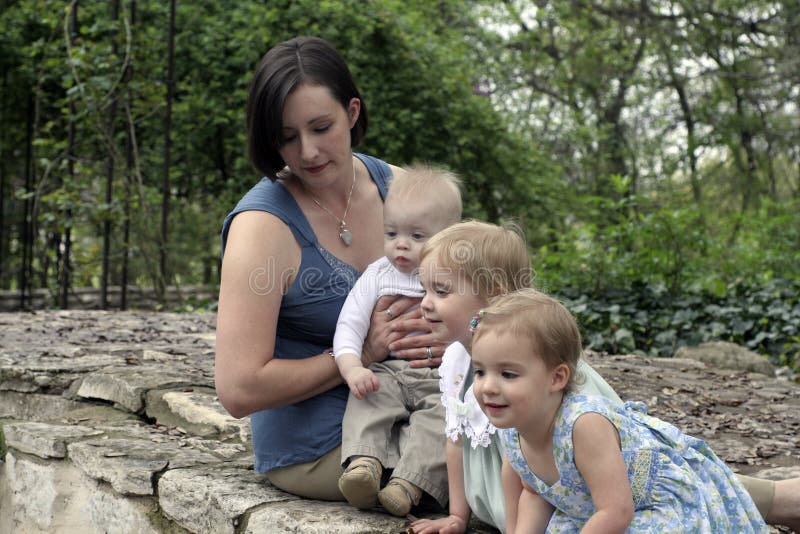Family Looking Over Bridge stock image. Image of child - 6119105