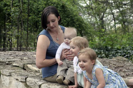 Family Looking Over Bridge stock image. Image of child - 6119105