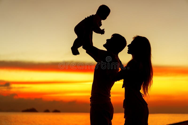 .Family in Love with Son Hugging at Sunset, Silhouette Stock Image ...