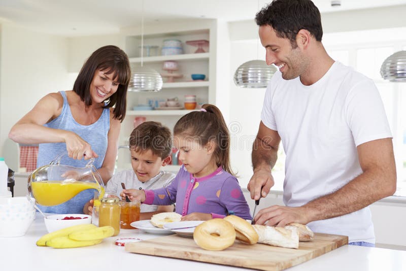 Family Making Breakfast in Kitchen Together Stock Image - Image of ...
