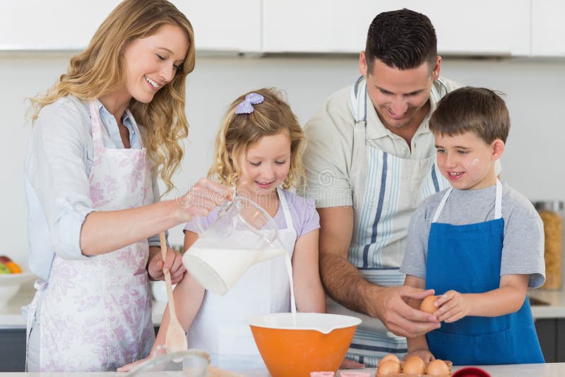 Family Making Cookies Together in Kitchen Stock Photo - Image of four ...