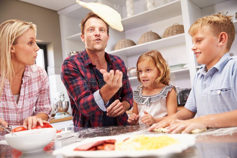 Family Making Pizza Together Stock Photo - Image of aged, life: 54734220