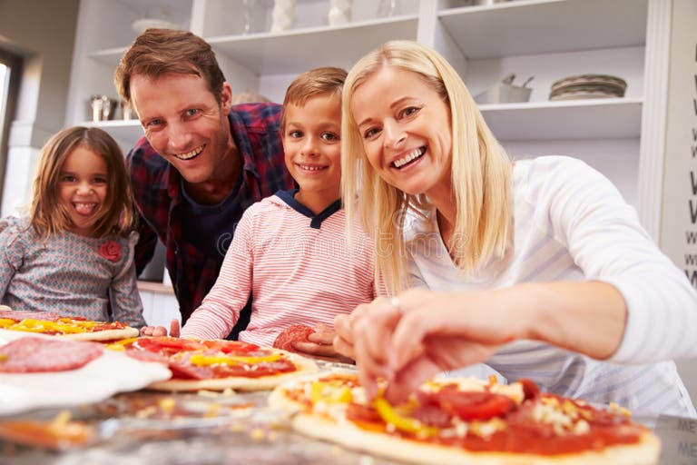 Family Making Pizza Together Stock Image - Image of horizontal, kitchen ...