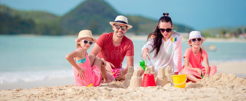 Family Making Sand Castle at Tropical Beach Stock Photo - Image of ...
