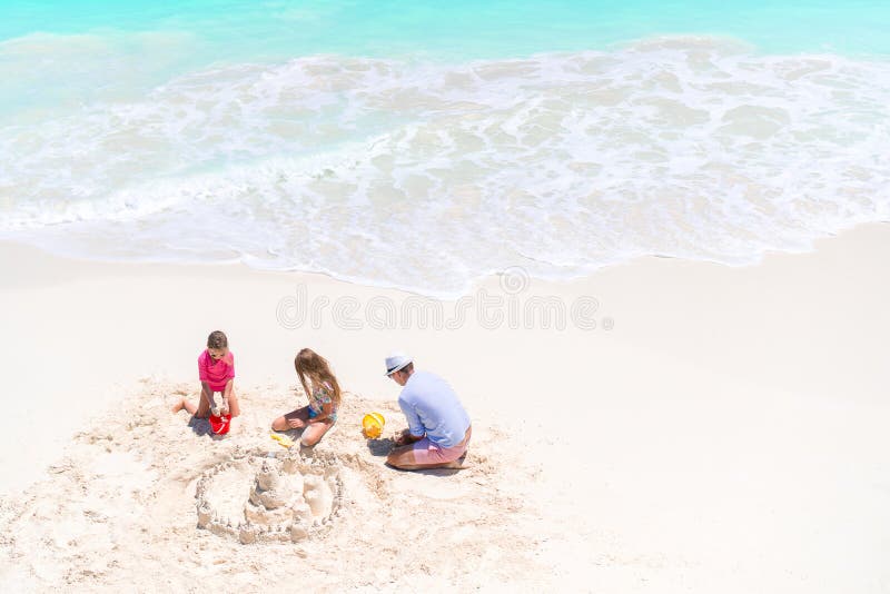 Family Making Sand Castle at Tropical White Beach. Stock Image - Image ...