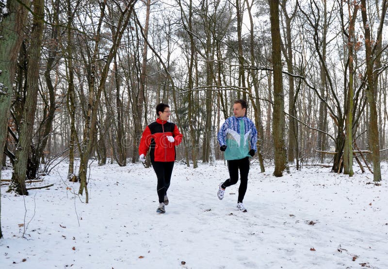 Family Members Running in the Snow Stock Image - Image of snowy ...