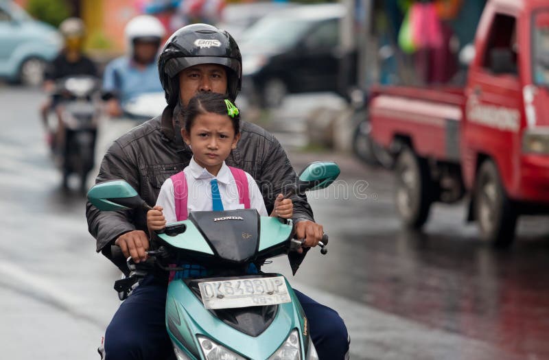 Family on motorcycle editorial photography. Image of indonesia - 23608582