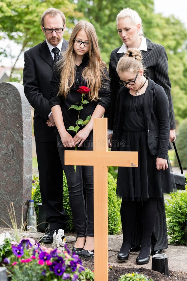 Family Mourning at Grave on Cemetery Stock Image - Image of grief ...
