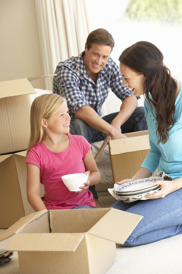 Young Family on Moving Day Looking Happy Stock Image - Image of ...