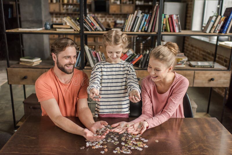 Family with One Child Playing with Puzzles at Home Stock Image - Image ...