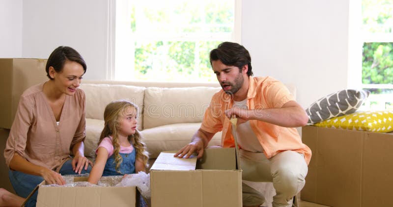 Family Opening Cardboard Box at New Home 4k Stock Video - Video of home ...