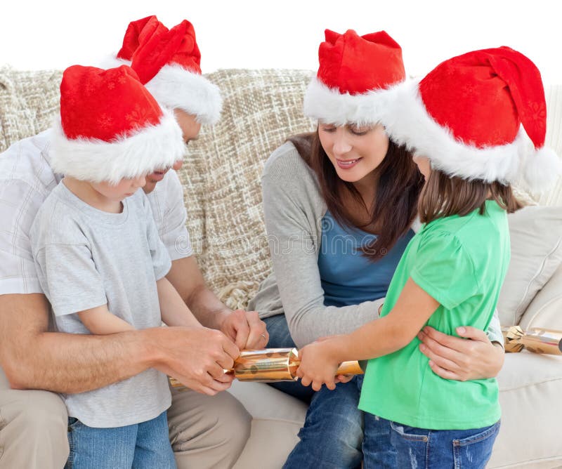 Family Opening Crackers Together on the Sofa Stock Image - Image of ...